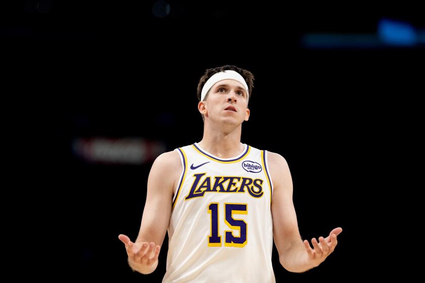 Lakers guard Austin Reaves out for at least a month because of calf injury