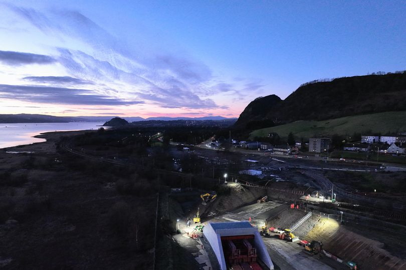 Footage shows railway bridge near Glasgow being guided into place on ...