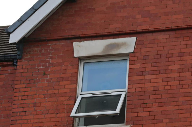 Person taken to hospital after flat fire closes main road