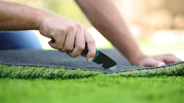 Cities are banning artificial turf. Here's what to know before ...