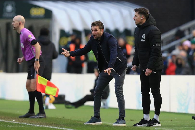 Tom Cleverley holds up hands too many Plymouth Argyle yellow cards
