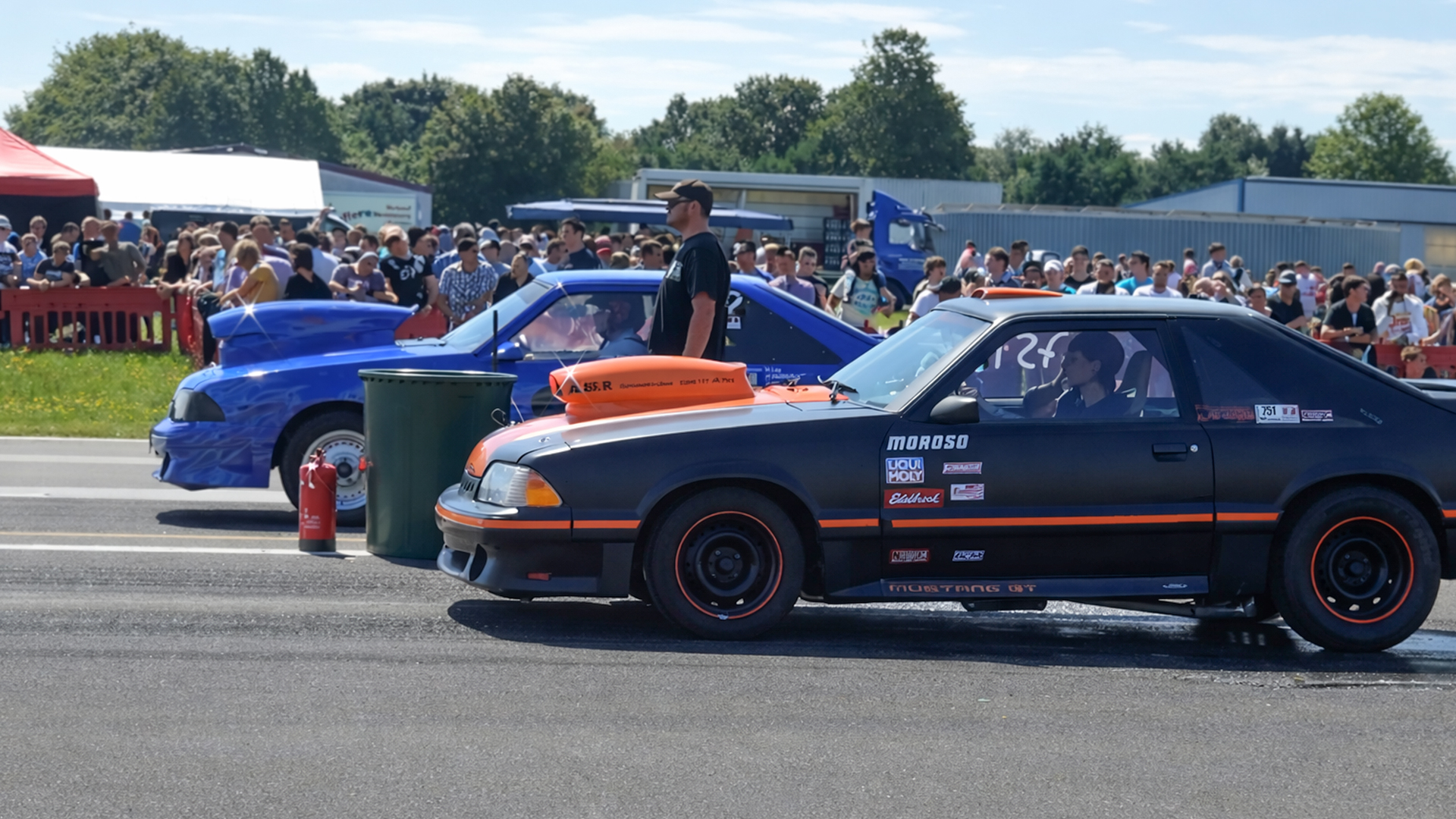 Quarter mile race between two Ford Mustangs