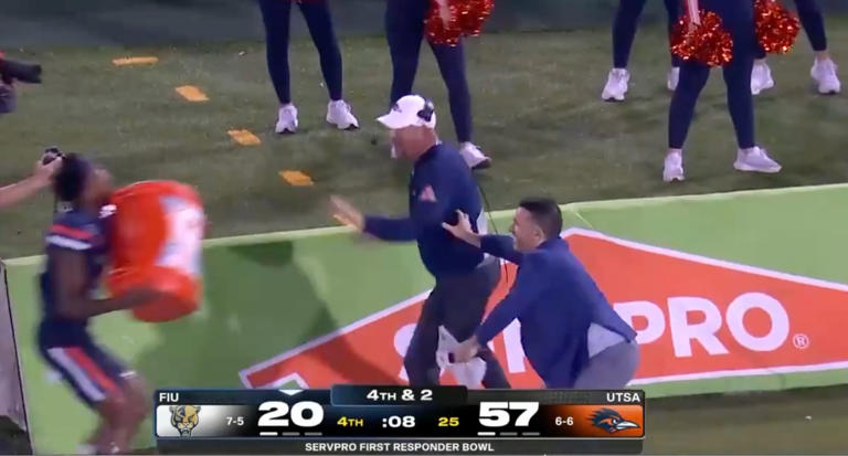 ESPN reporter blocks coach for Gatorade bath