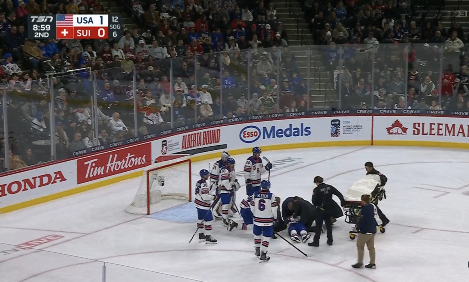 Cole Hutson leaves the WJC game against Switzerland on a stretcher