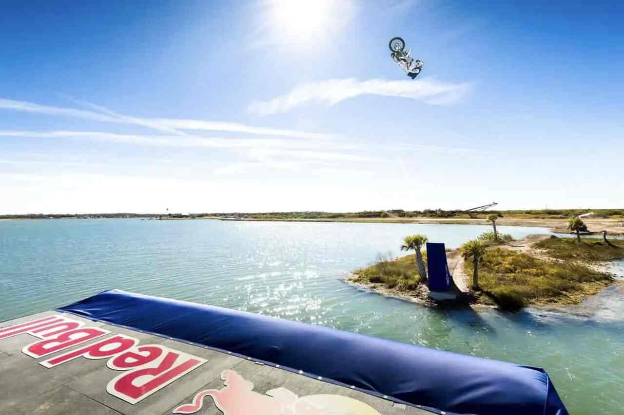 Amazing video: Motorcyclist performs a series of jumps over water on a ...