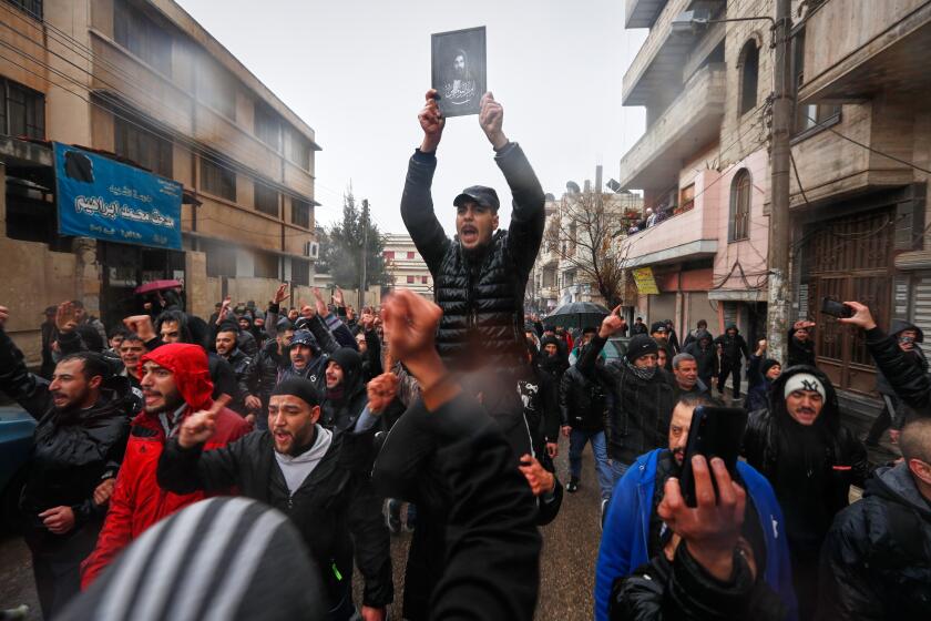 Hundreds mourn in Syria's Homs after deadly mosque bombing