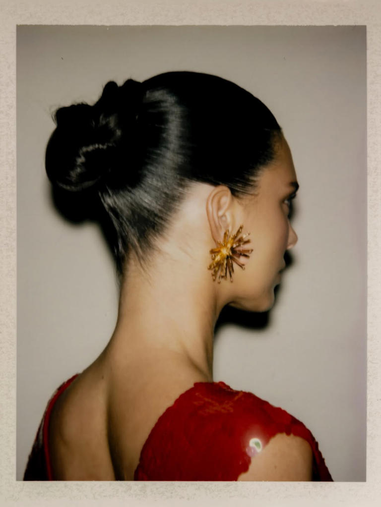 Kendall Jenner pairs her Chanel holiday collection bag with a runway look