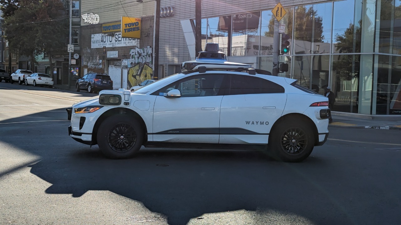 Waymo literally hires humans to shut robotaxi doors for $22 a pop