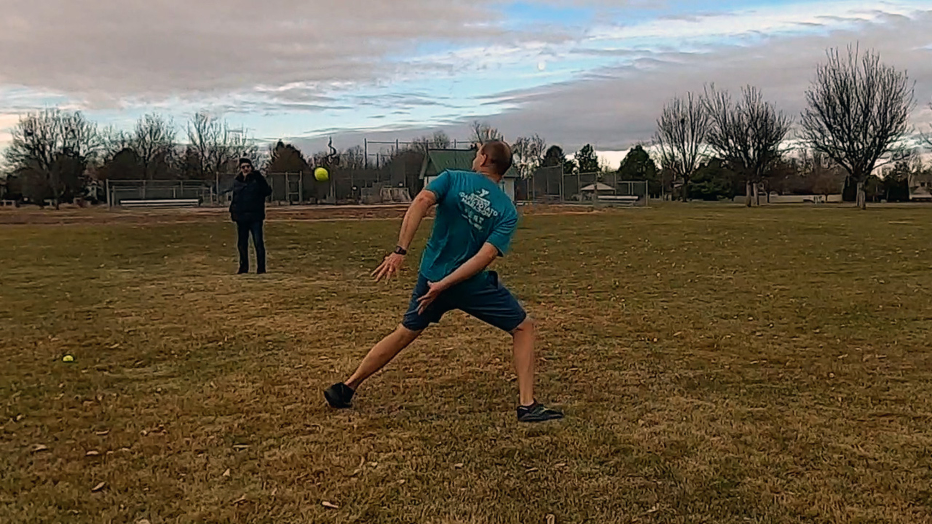 Farthest behind the back catch of a tennis ball 60.7 m (199 ft) by ...