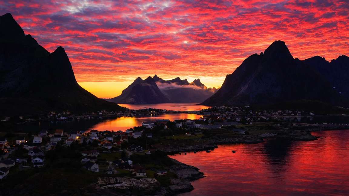 Fiery sunset above serene coastal village