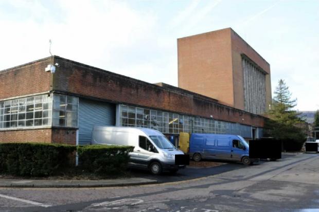 Adaptations including roller shutters made to listed building without ...