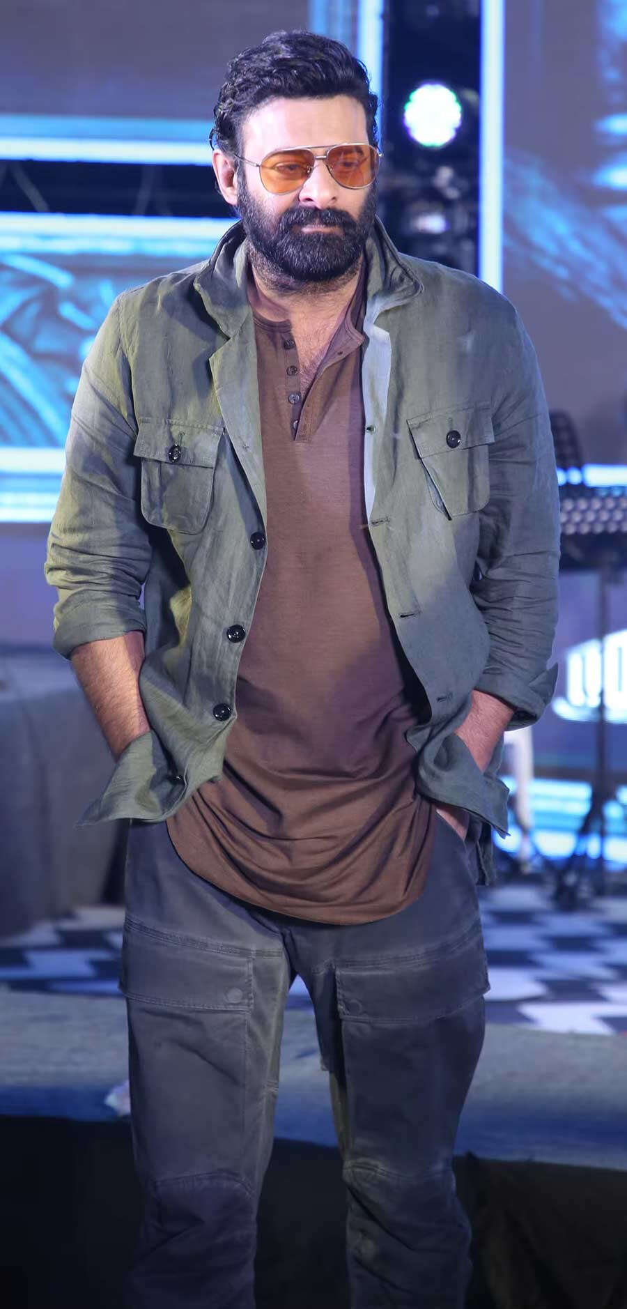 Pics: Prabhas flaunts a man bun at the Raja Saab pre-release event