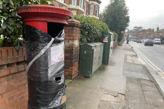 Why are post boxes across Worcester wrapped in black bags?