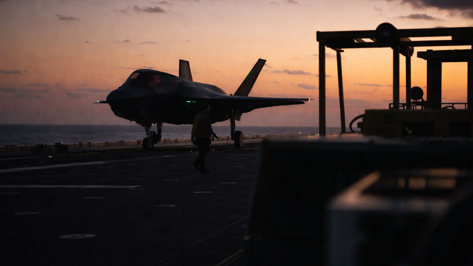 USS Tripoli conducts night flight operations in the Pacific