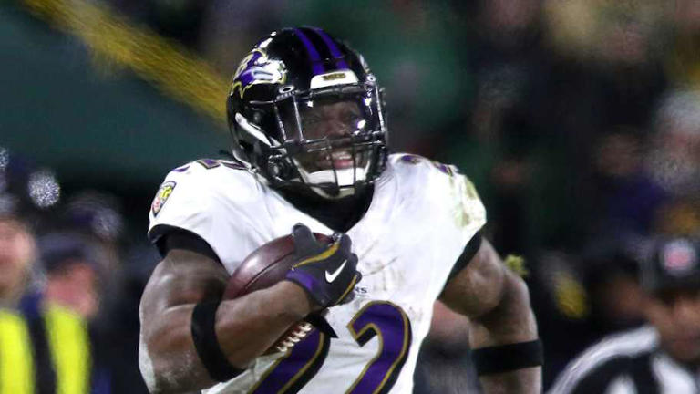 Record-setting Derrick Henry shreds Packers’ defense, wears hat to prove it