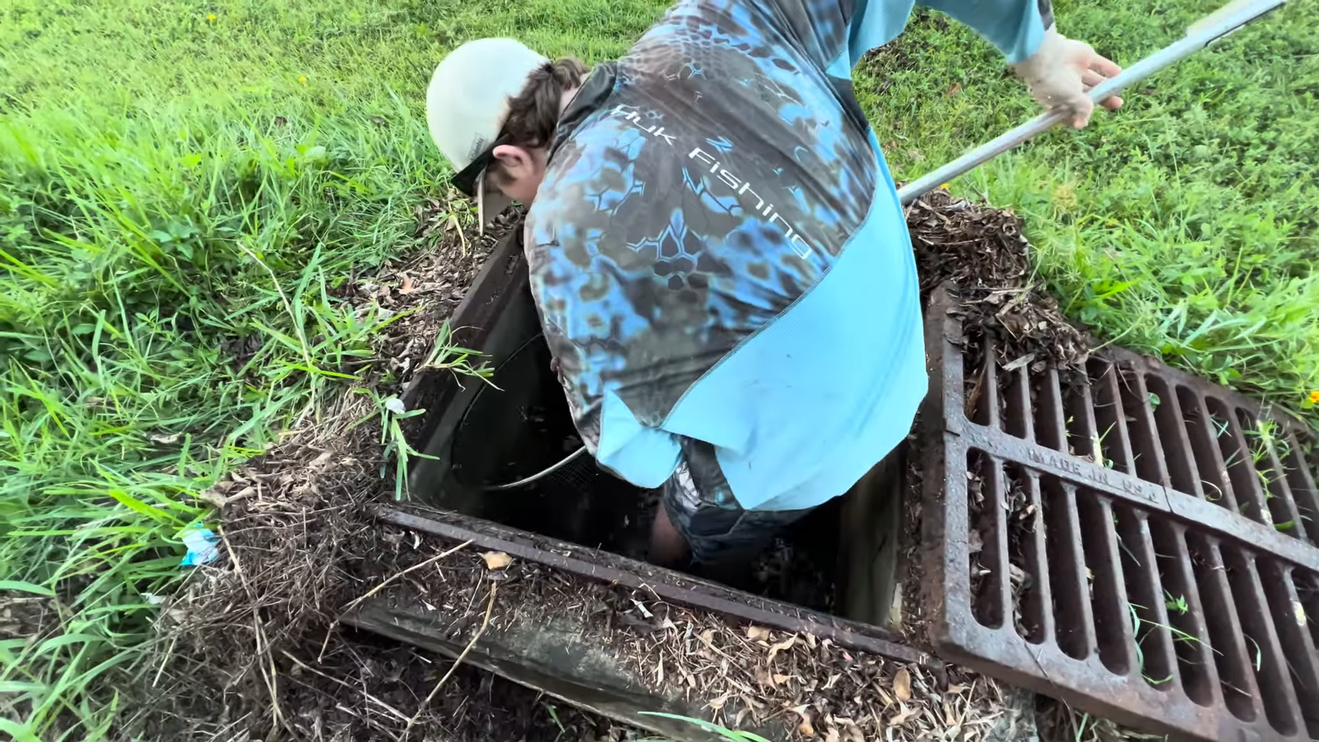 Netting aquarium fish trapped in a flooded sewer