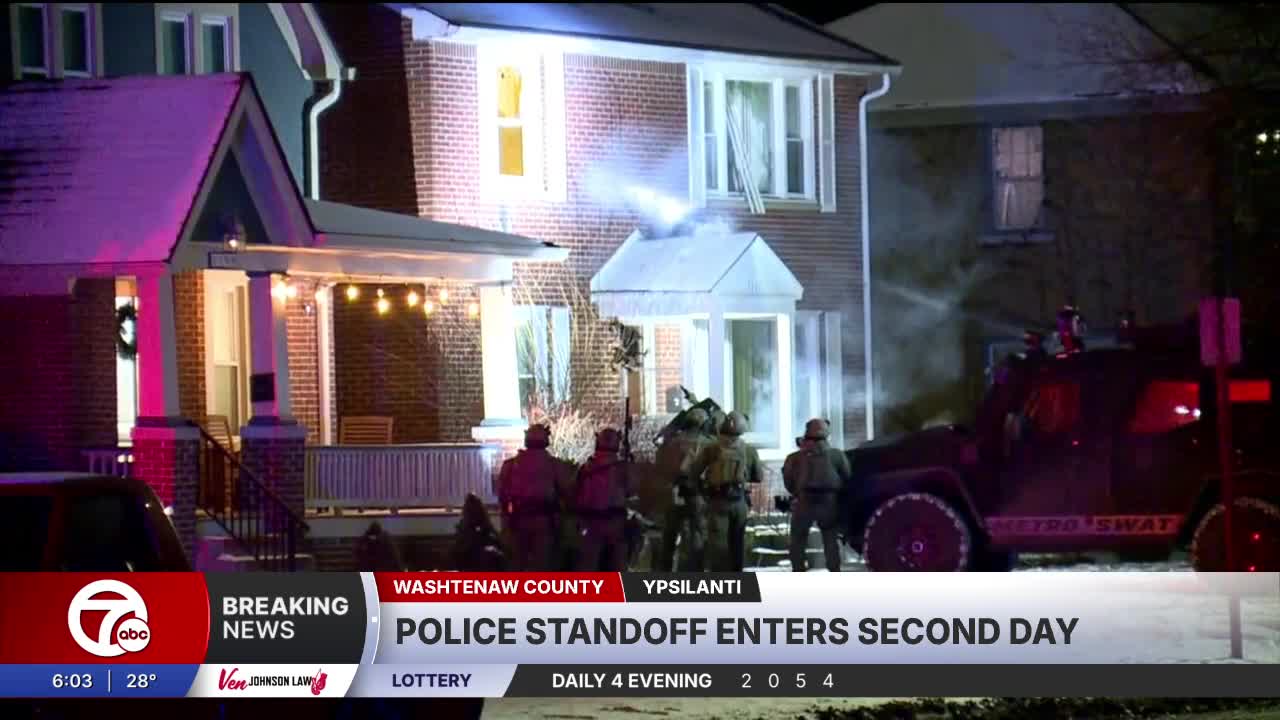 Police standoff enters second day after man barricades himself with ...