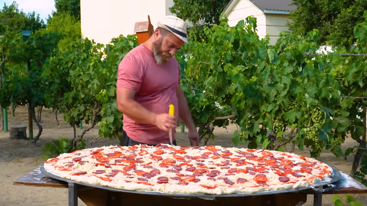 How cooking pizza on hot coals makes the best crust and most flavor