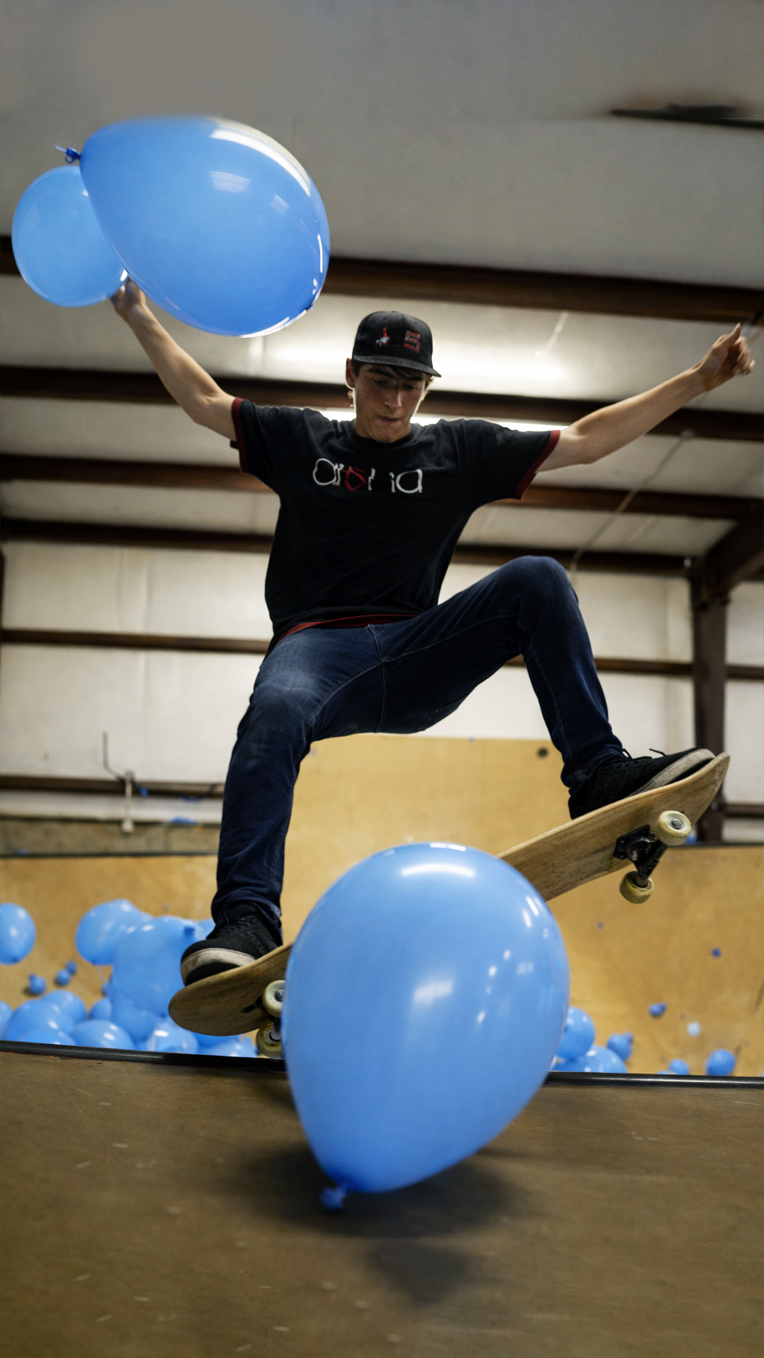 Trying a skateboard trick into a ball pit