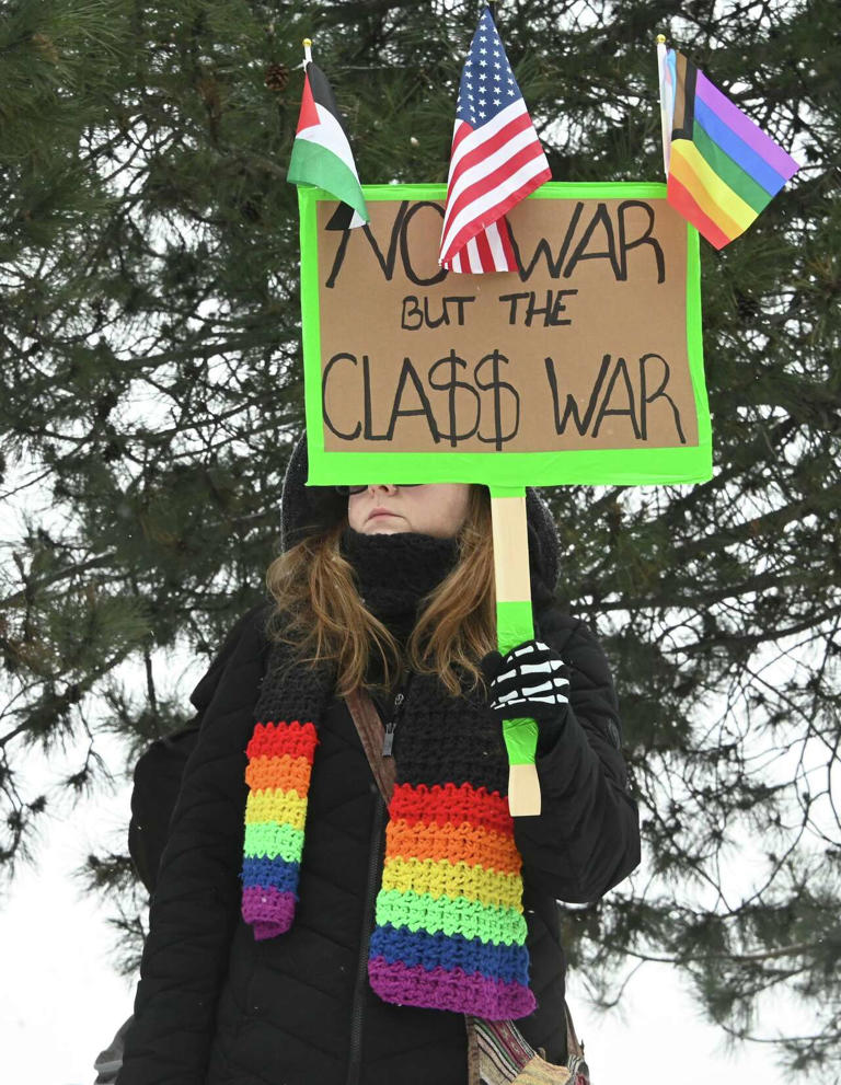 Photos: Protesters speak out against military action in Venezuela