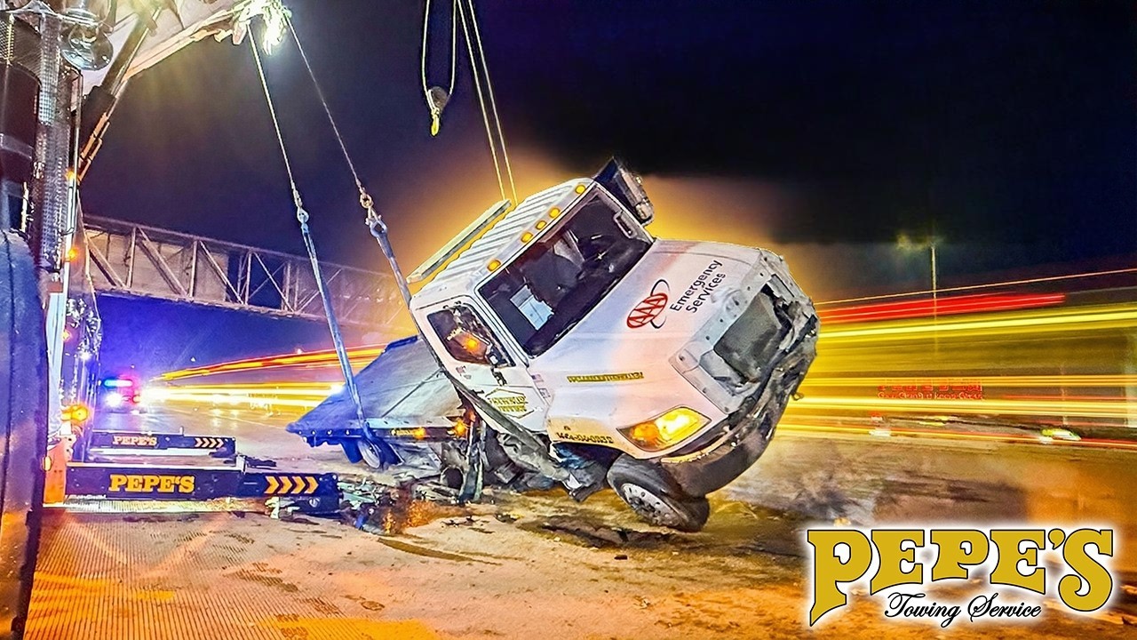 AAA tow truck crashed into divider and rolled over