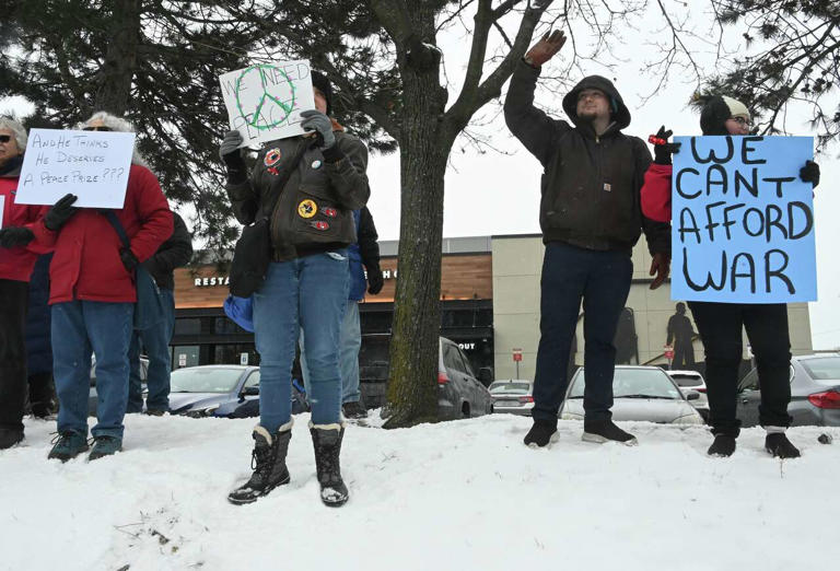 Photos: Protesters speak out against military action in Venezuela