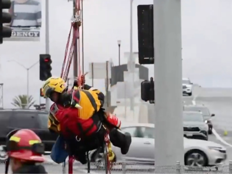 OC man rescued from 'cold, fast-moving' water during storm