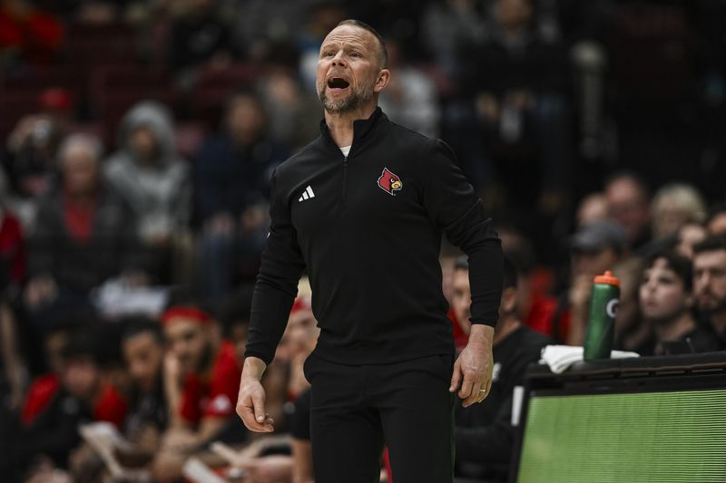 Louisville freshman Mikel Brown Jr. (back) out again vs. Duke