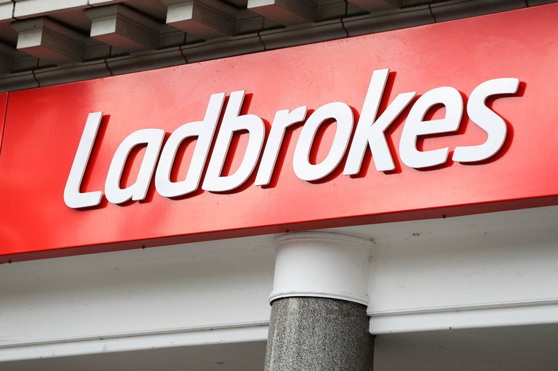 Man storms Ladbrokes pointing 'unknown item' in carrier bag at ...