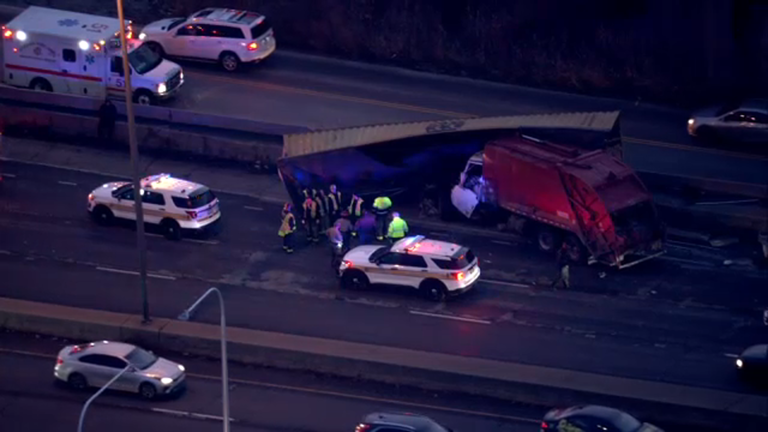 Driver injured after dislodged semi trailer hits garbage truck on ...