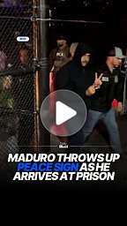 Maduro throws up a peace sign as he arrives at New York City prison