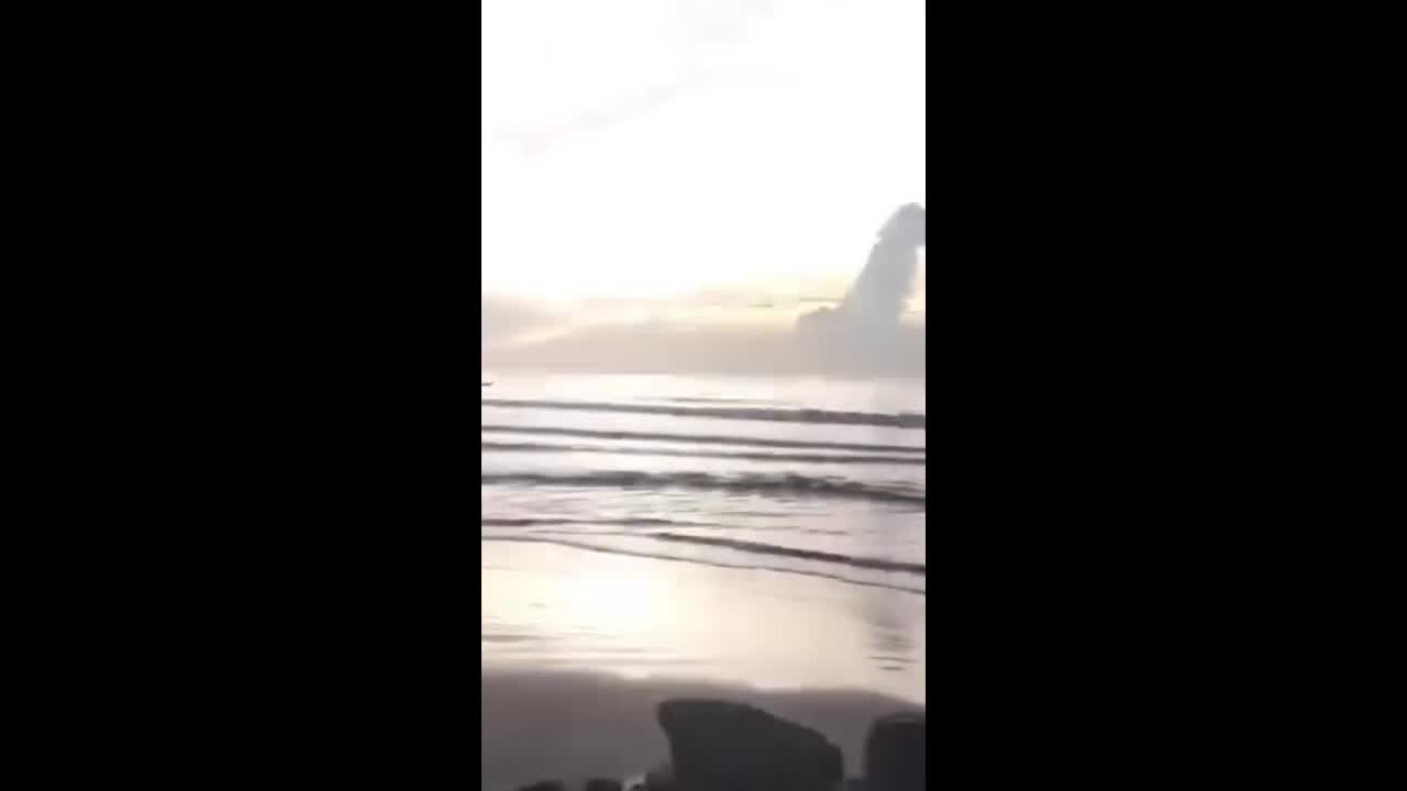 Cheeky nature! Phallic-shaped cloud amuses residents on beach in Indonesia