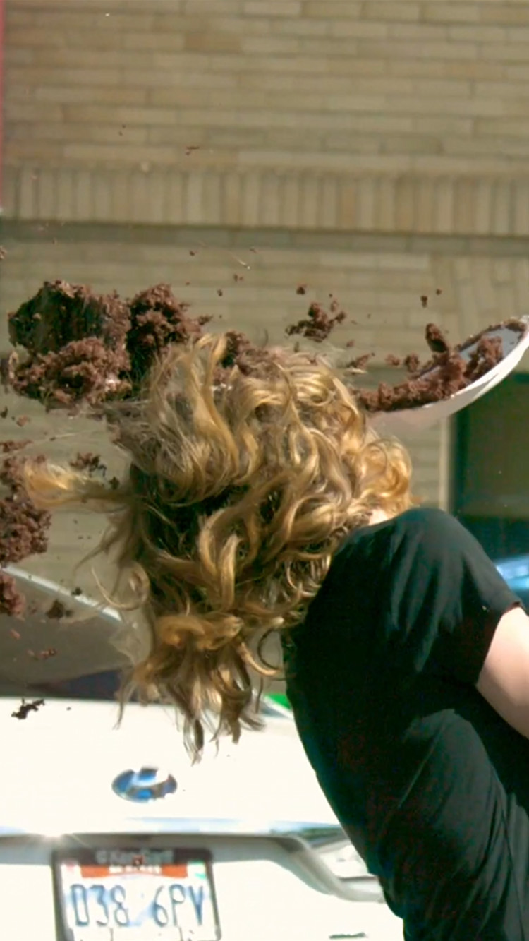 The moment a cake hits in slow motion