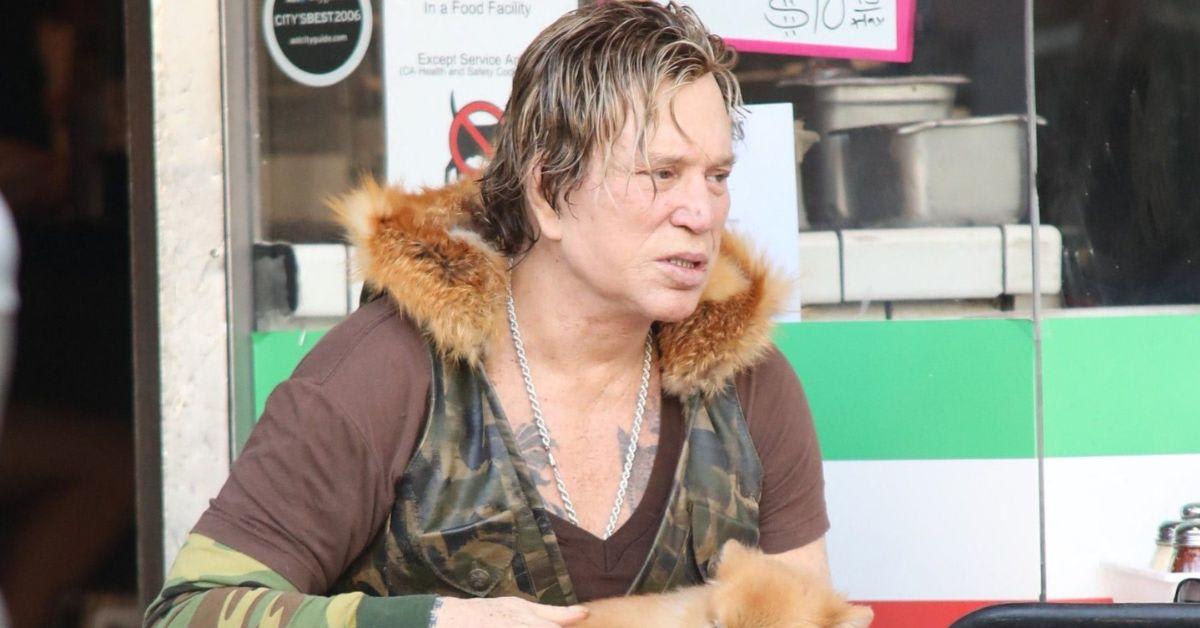 Disheveled Mickey Rourke, 73, checks into hotel with his dog following ...