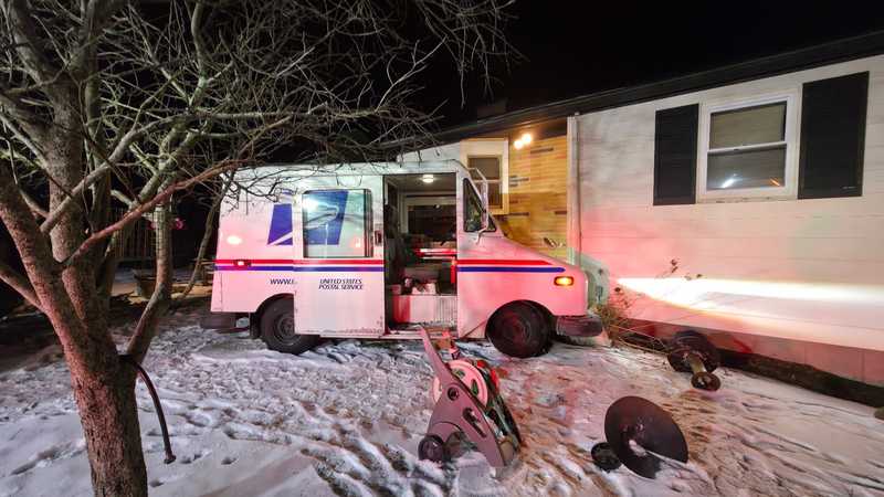 USPS driver injured after crashing into Mass. home