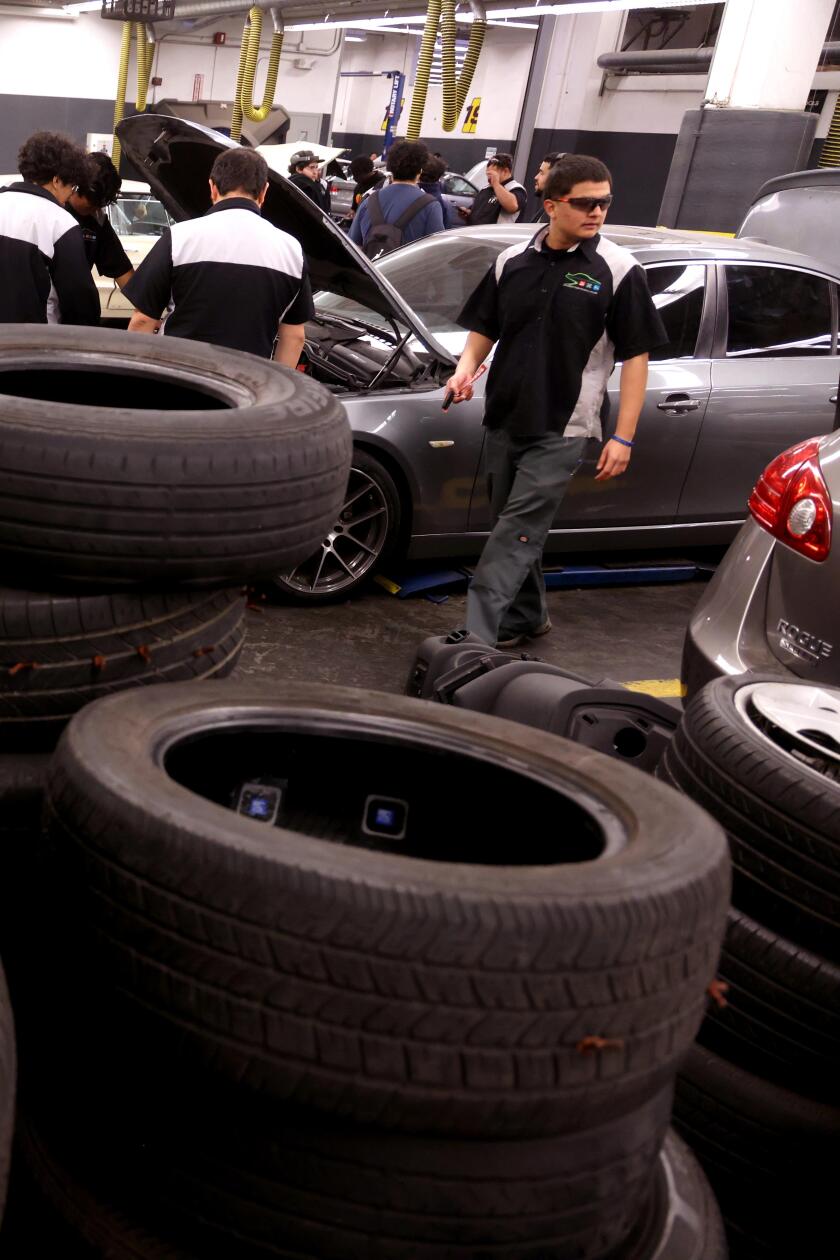 Auto shop class is thriving. Community college students basically fix ...