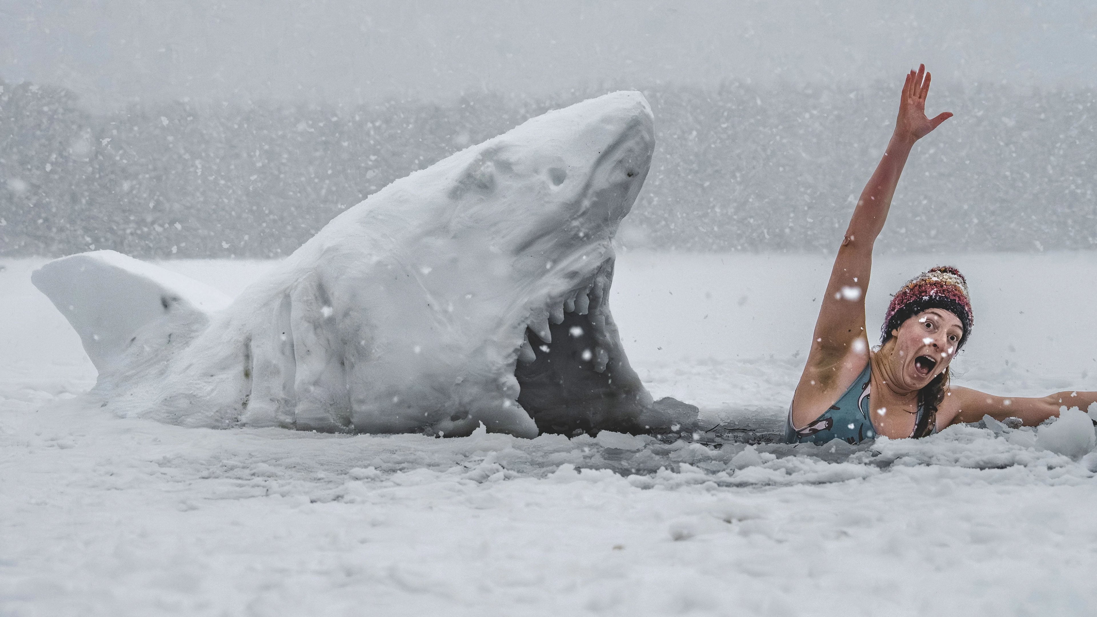 Photos show cold water swimmer in a frozen loch - with snow sharks
