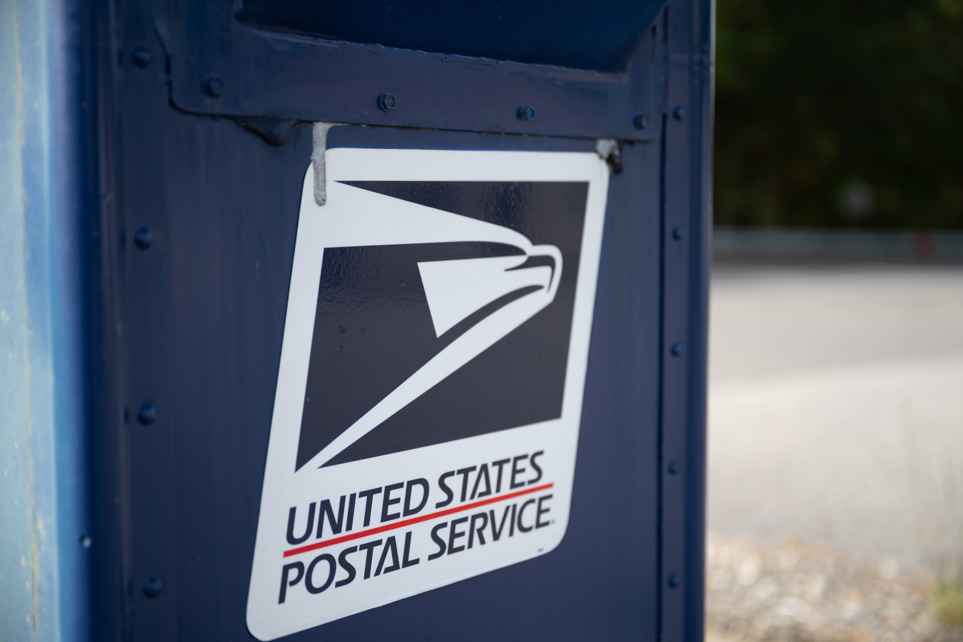 USPS truck crashes into Mass. home, driver injured