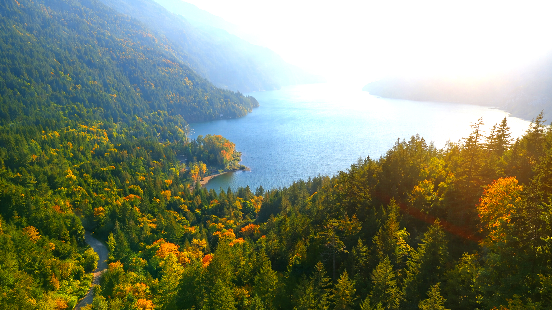 Fall colors reflecting on the calm waters of Harrison Lake