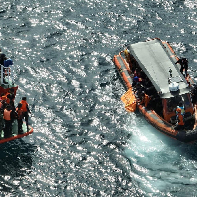 Sunken tourist boat and body found after soccer coach, 3 kids go missing