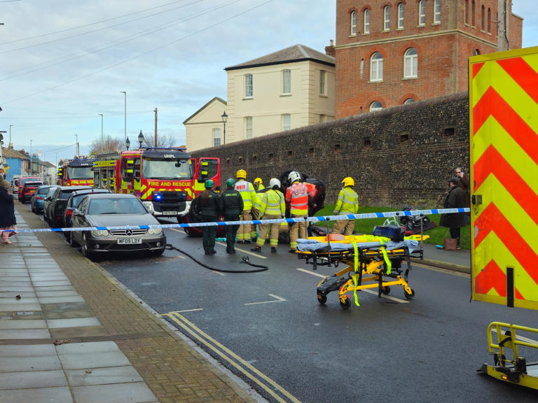 Watch: Trapped female driver released from car which flipped after ...
