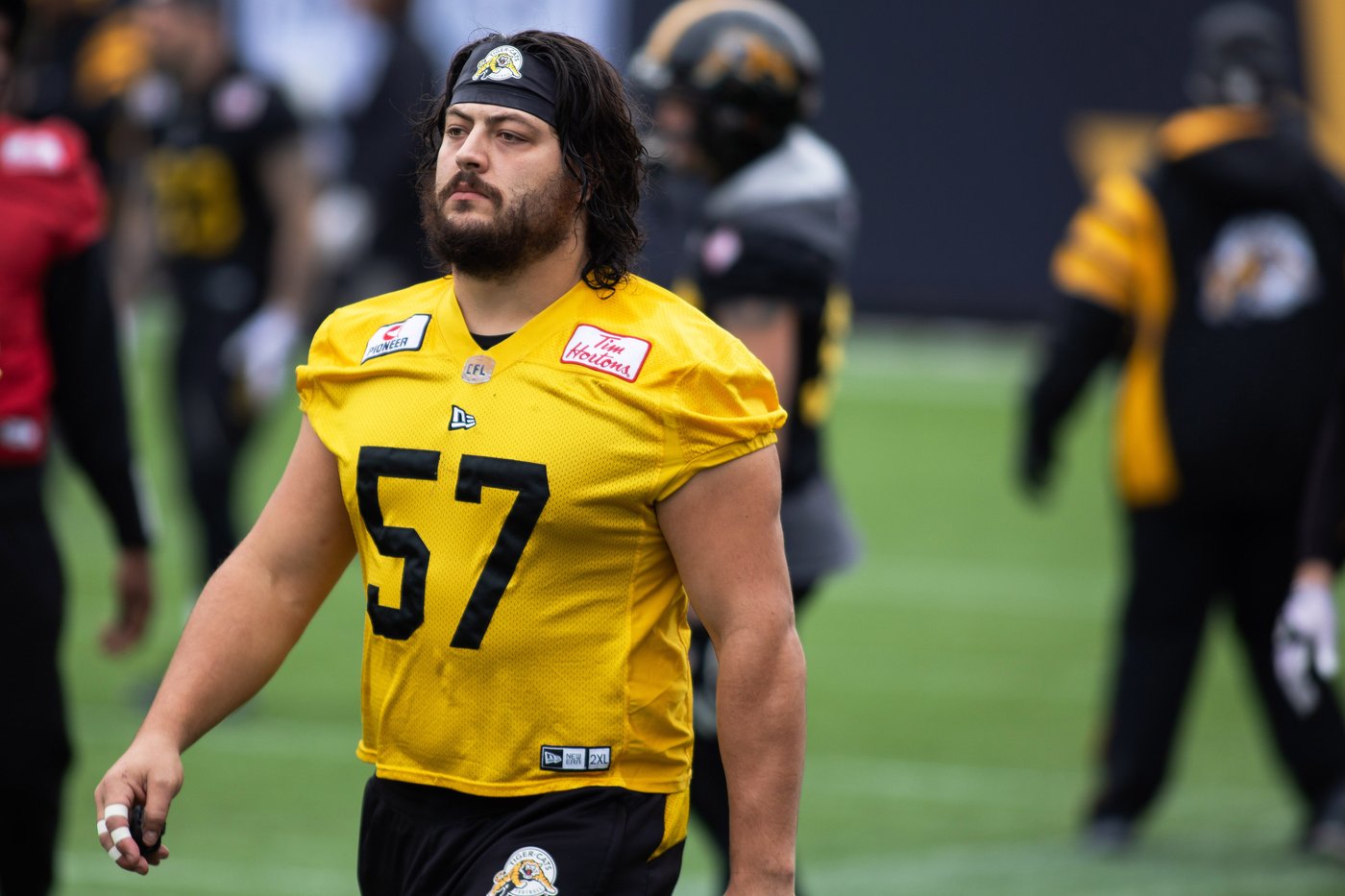 Tiger-Cats re-sign lineman Revenberg; Bombers extend defensive back Holm