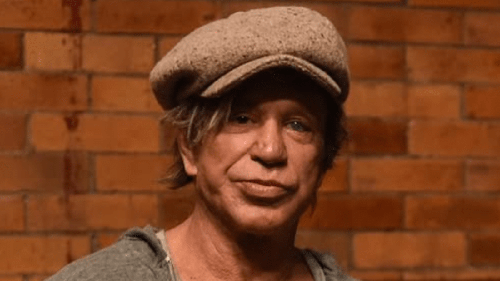 Mickey Rourke dons wig to flee LA home in shambles, checks into £400-a ...