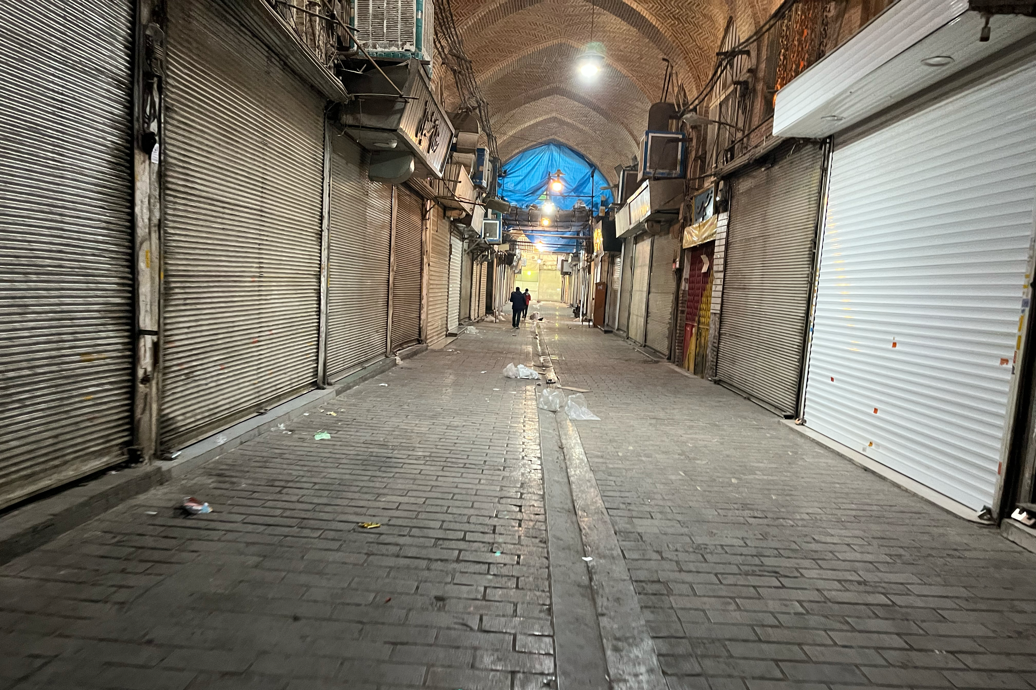 Security forces clash with protesters in Iran’s main market