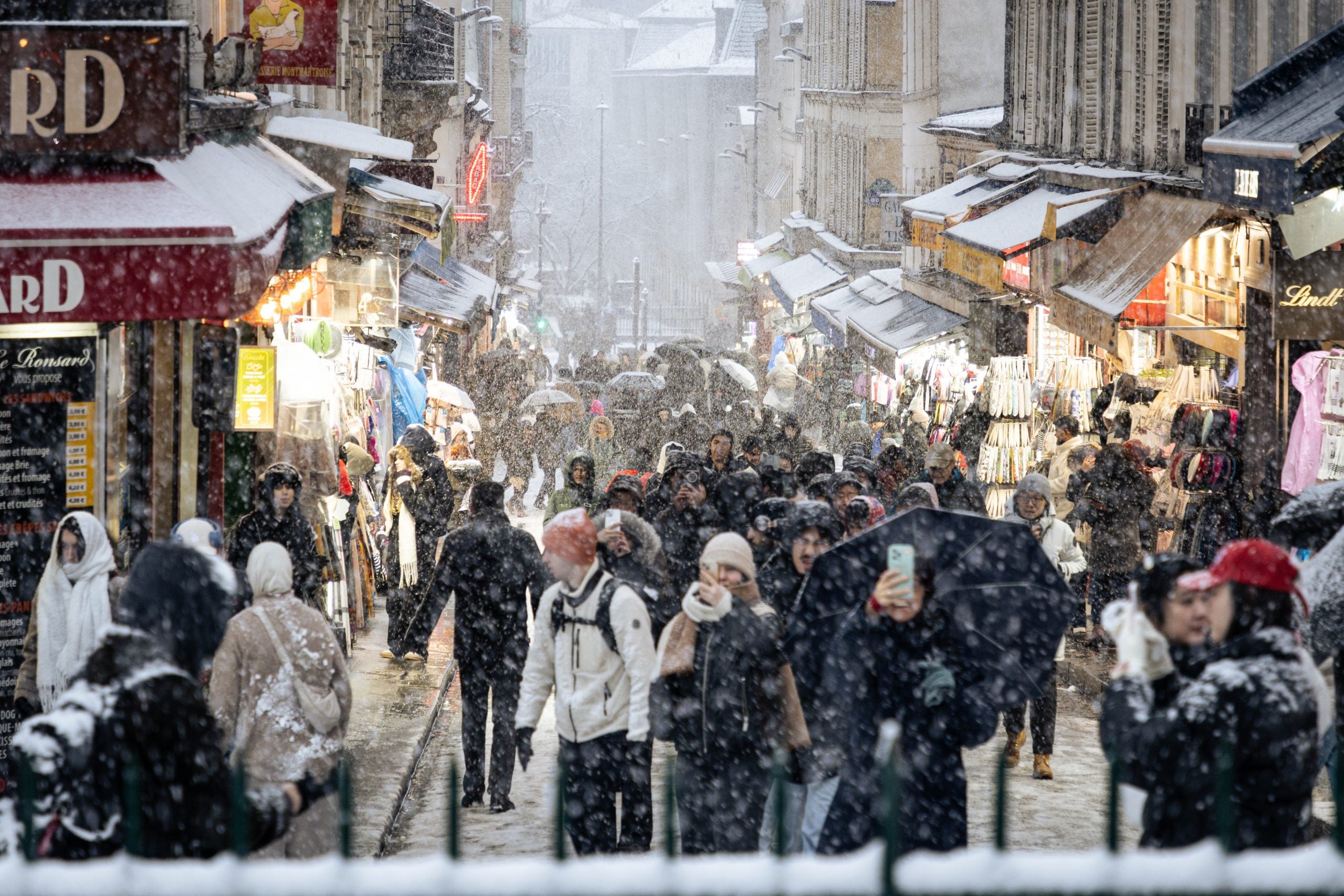 Watch: Streets of Paris transformed into downhill ski slope as snow ...