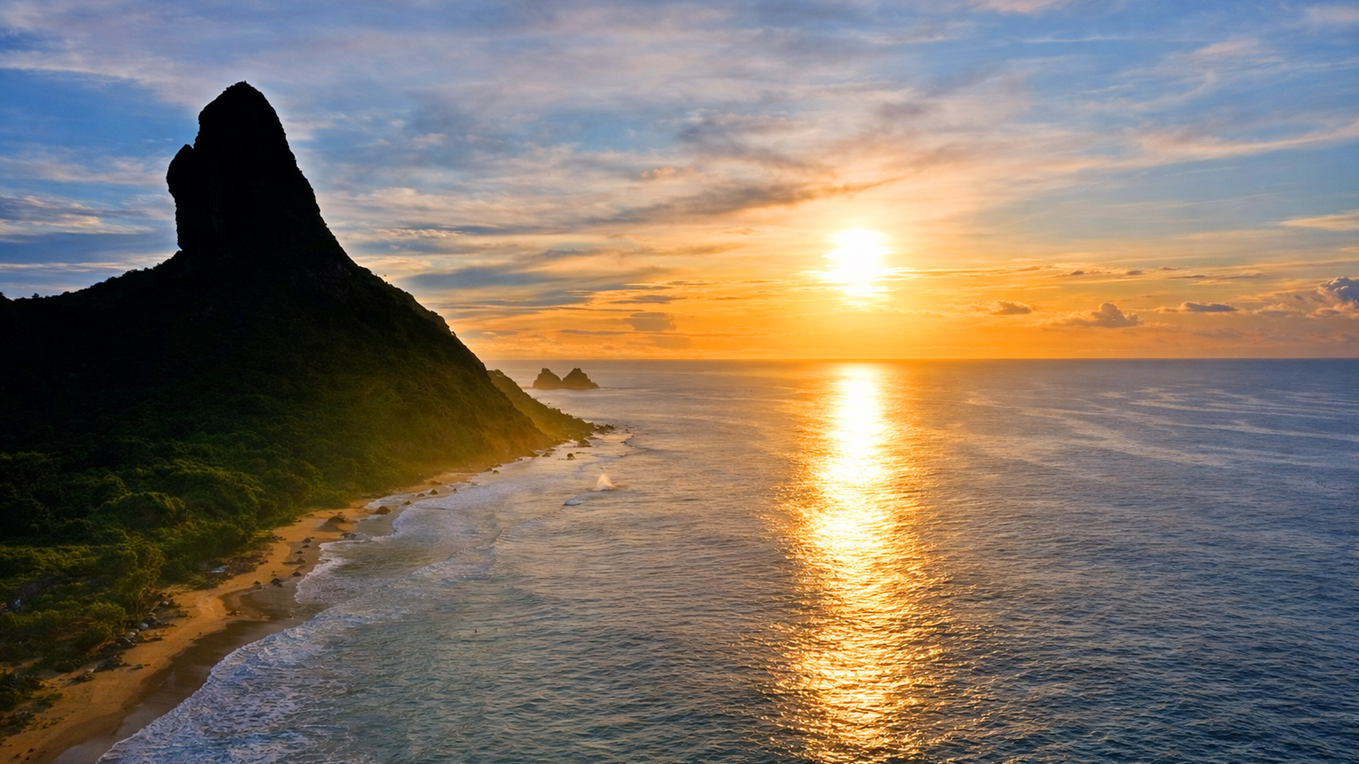 Volcanic cliffs silhouetted at sunset in Fernando de Noronha