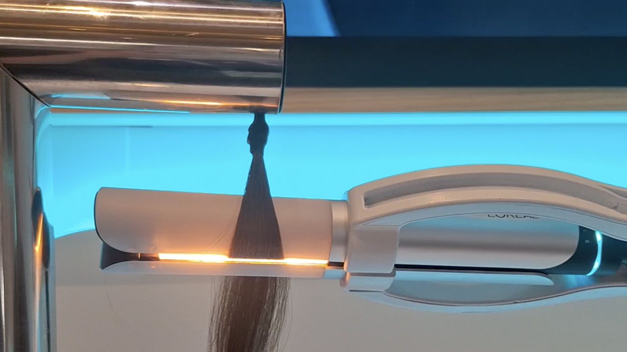 I just saw L'Oréal's new glass hair straighteners in action, and I was ...