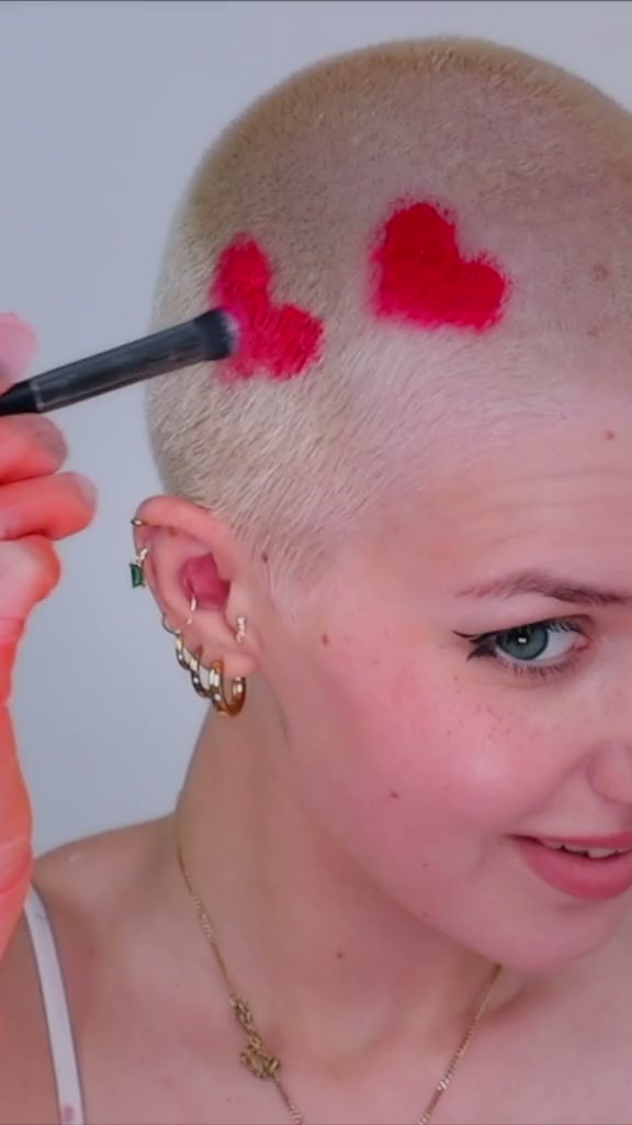 Buzzcut makeover with hot pink heart hair art