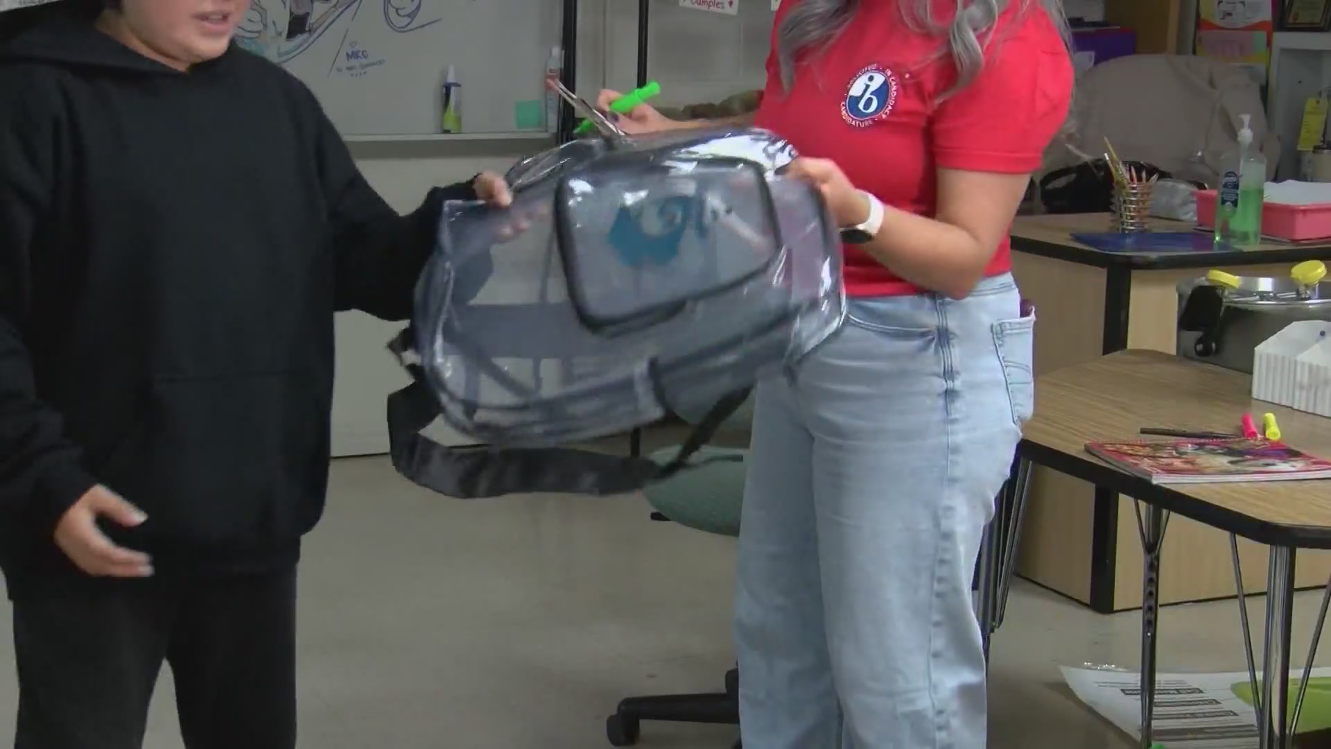 APS hands out clear backpacks for middle school students as policy goes ...