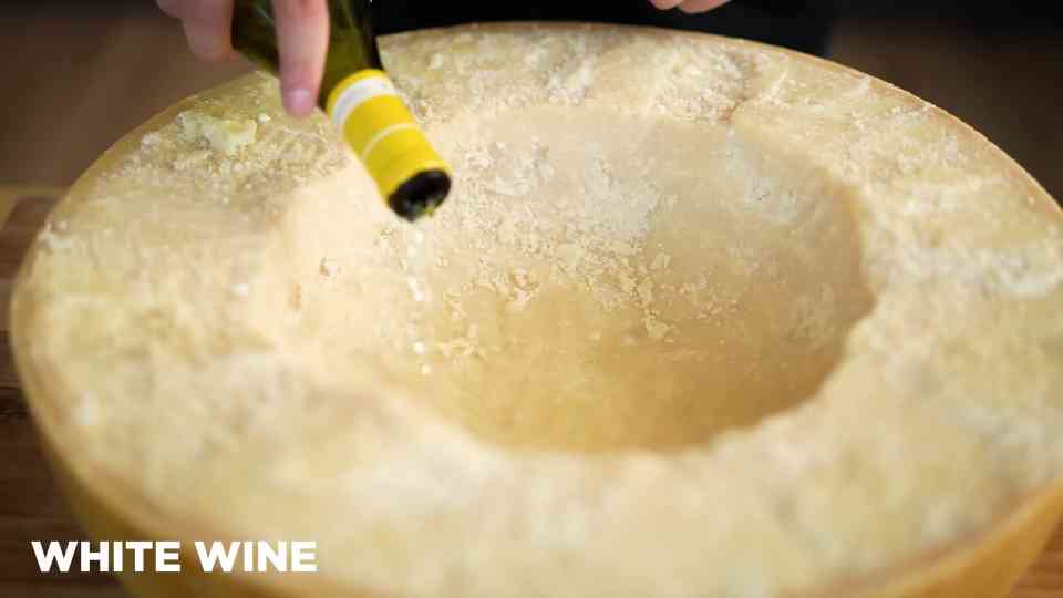 Making pasta in a parmesan cheese wheel
